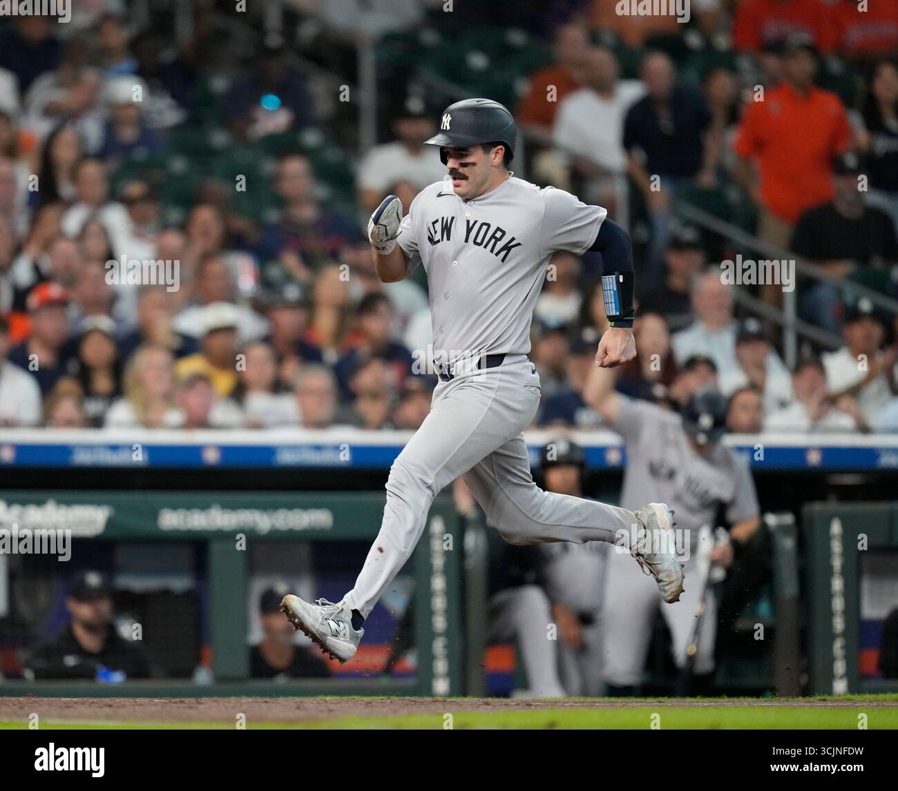 New York Yankees' Austin Wells runs home to score a run on New York ...