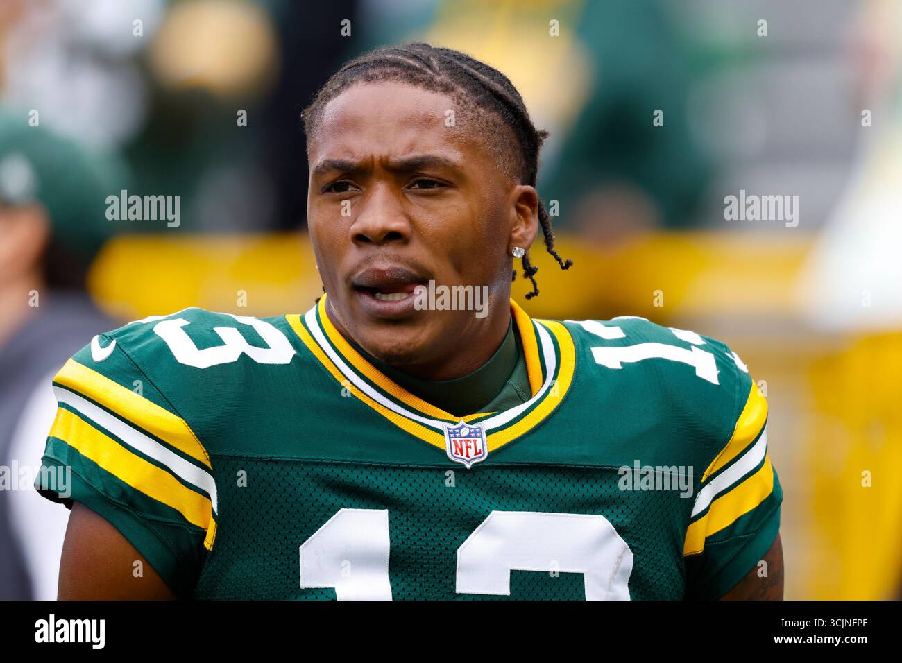 Green Bay Packers wide receiver Dontayvion Wicks (13) walks on the ...