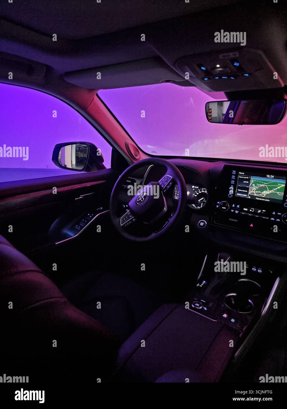 Toyota Highlander interior in the dark. Driver's cockpit filled with ...
