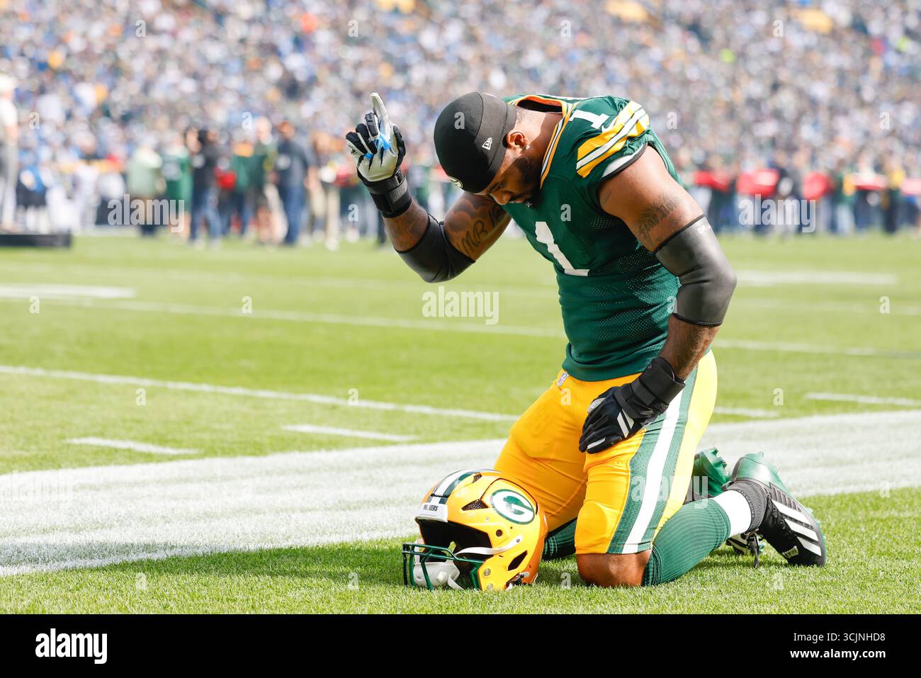 Green Bay Packers defensive end Micah Parsons (1) pauses on the field ...