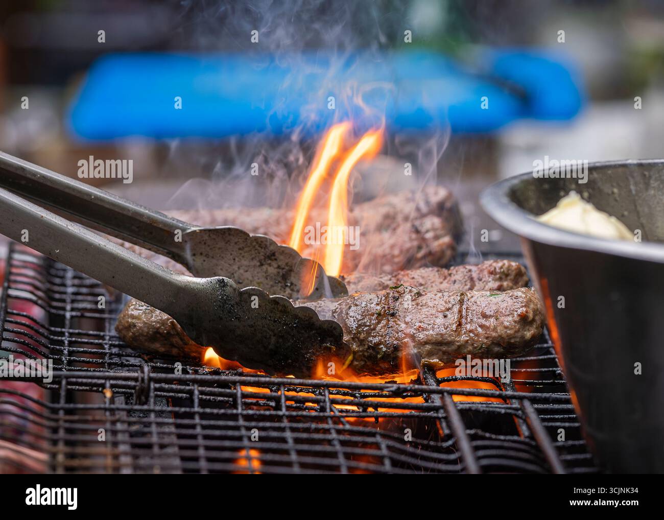Grilling arabian lamb kofta over warm coal heat. Arabic tasty kofta ...