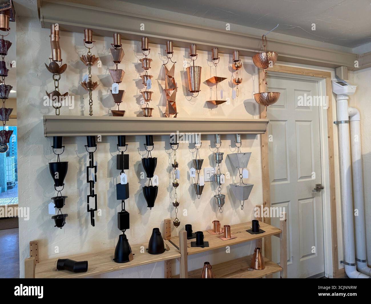 Rain chains that direct water from atop buildings into storage ...