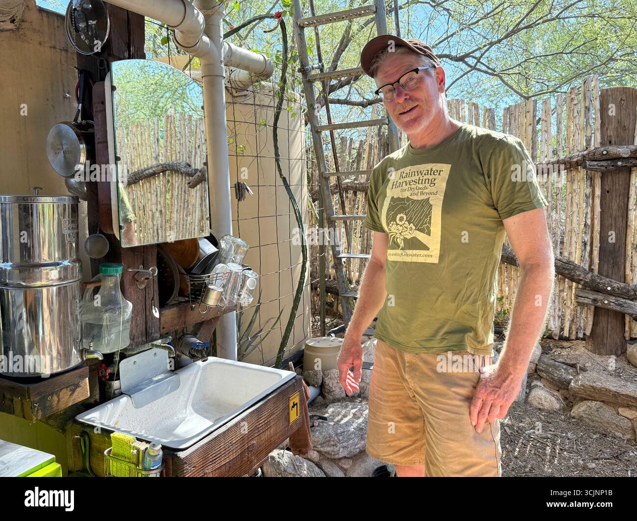 Rainwater harvesting expert Brad Lancaster poses at his outdoor home ...