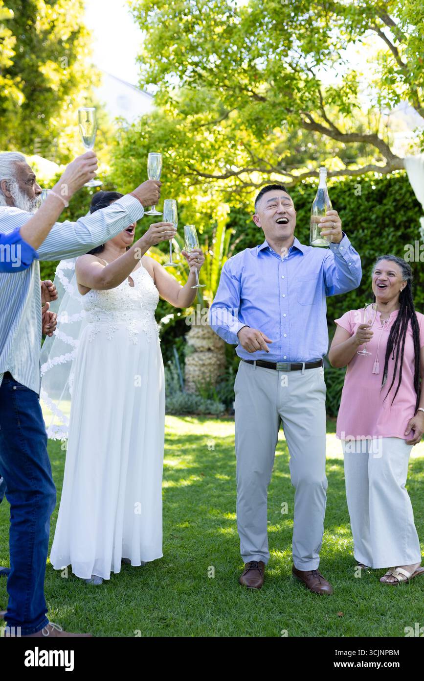 Celebrating champagne glasses diverse senior hi-res stock photography ...