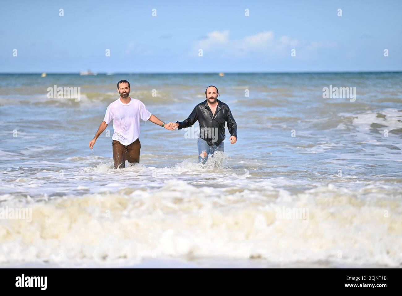 Jury members Vincent Macaigne, Benjamin Millepied posing at the beach ...