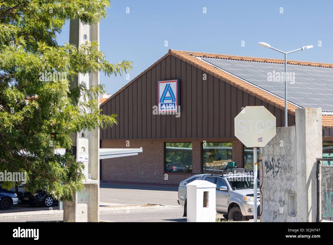 Exterior view of an aldi supermarket building featuring solar panels on ...
