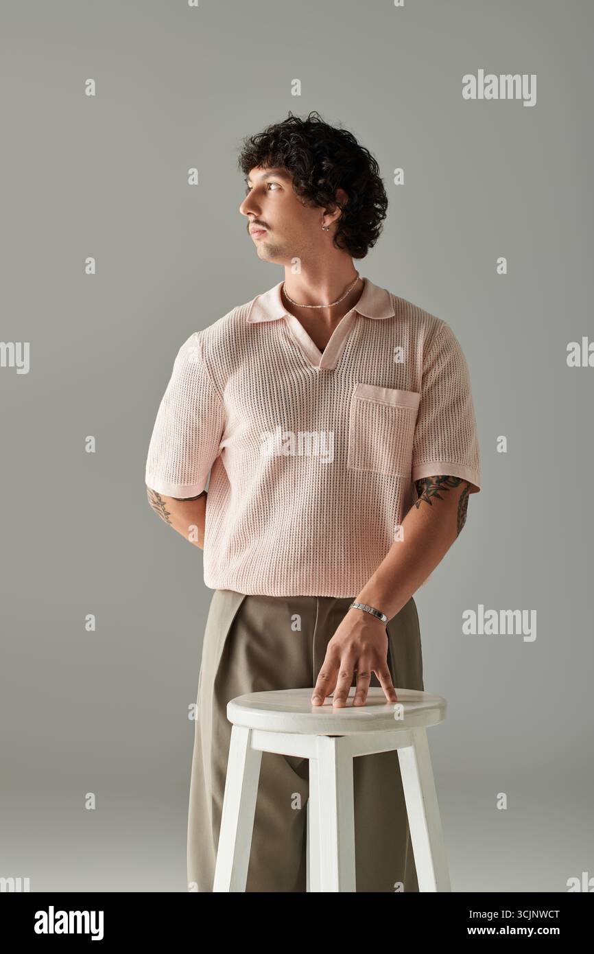 Young man stands confidently beside hi-res stock photography and images ...