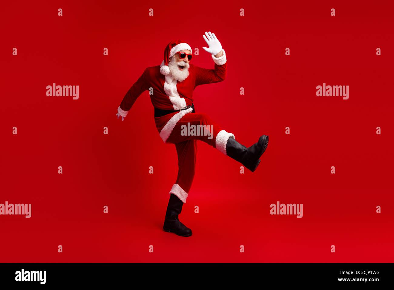 Festive Santa Claus Dancing with Holiday Cheer on a Red Background for ...
