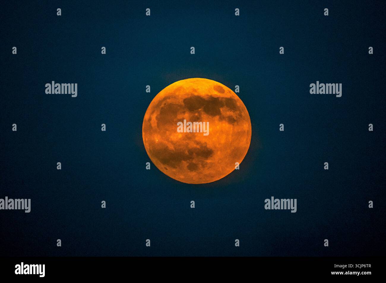 A red full moon also known as a blood moon seen during a lunar eclipse ...