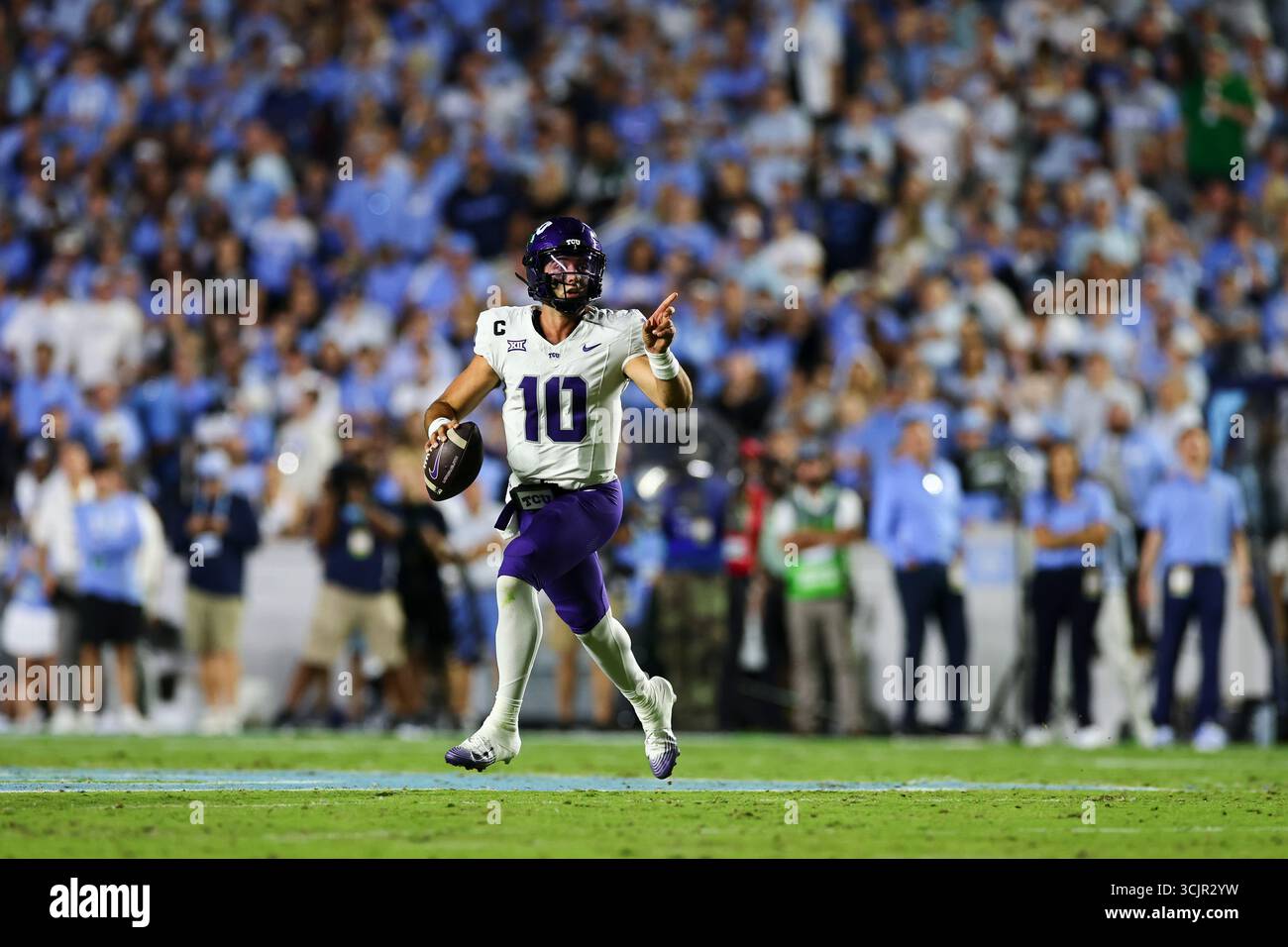 TCU quarterback Josh Hoover (10) rolls out to throw a pass during an ...