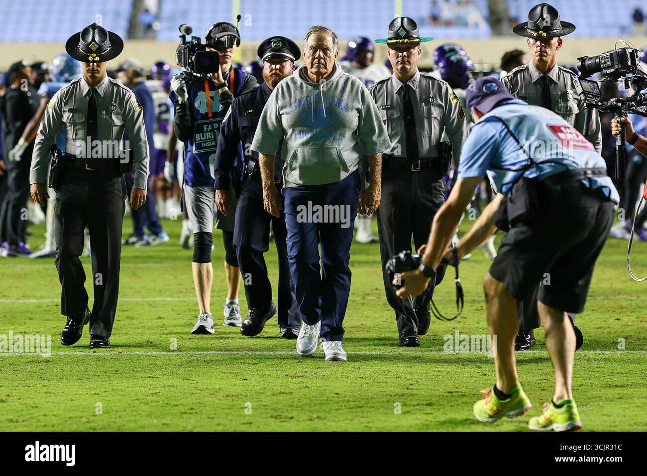 North Carolina head coach Bill Belichick walks off the field following ...