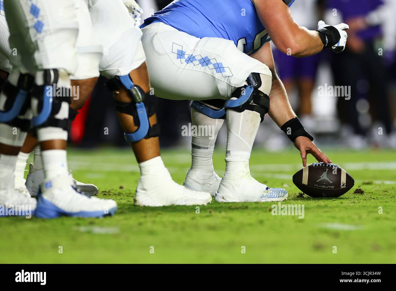 A detail of the Nike Jumpman logo on the ball on the line of scrimmage ...