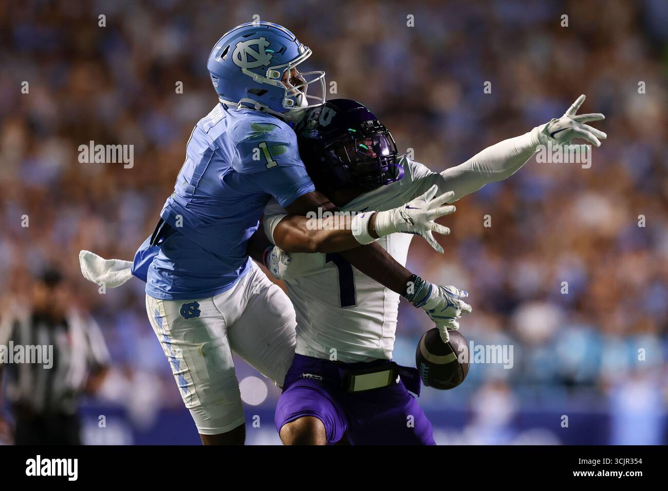 TCU safety Austin Jordan (1) breaks up a pass intended for North ...