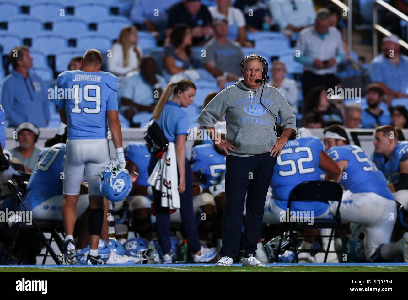North Carolina head coach Bill Belichick coaches from the sideline ...