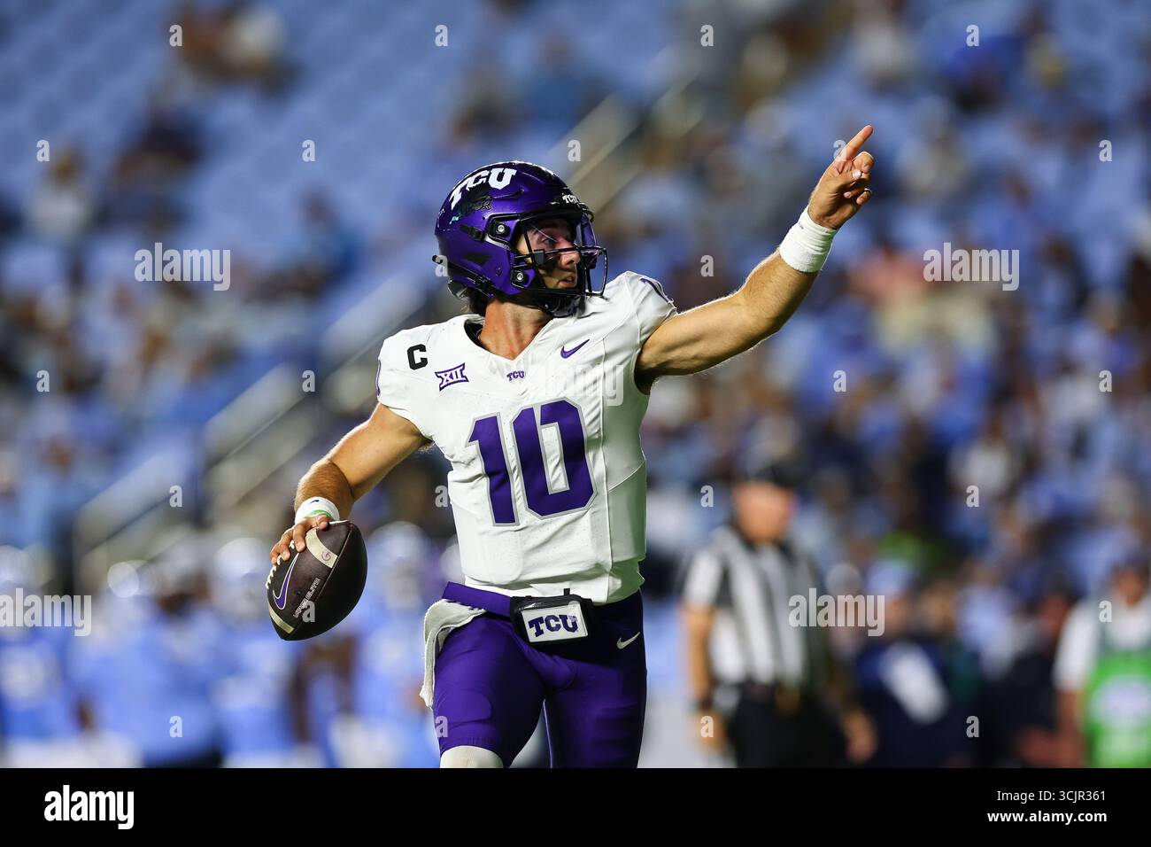 TCU quarterback Josh Hoover (10) rolls out to throw a pass during an ...