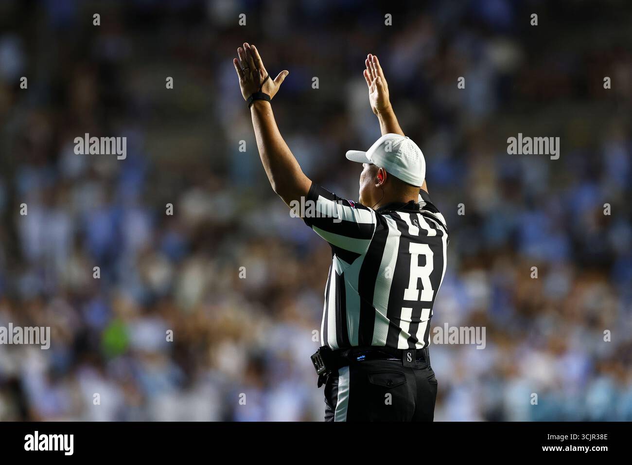 The referee signals during an NCAA college football game between North ...