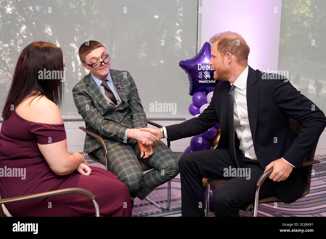 The Duke of Sussex shakes hands with with Declan Bitmead (centre ...