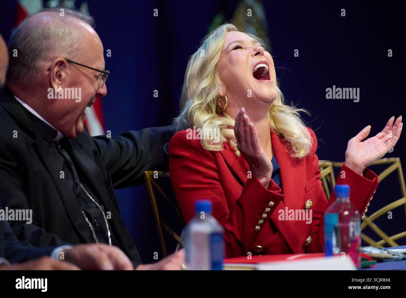 Cardinal Timothy Dolan talks with Pastor Paula White during the White ...