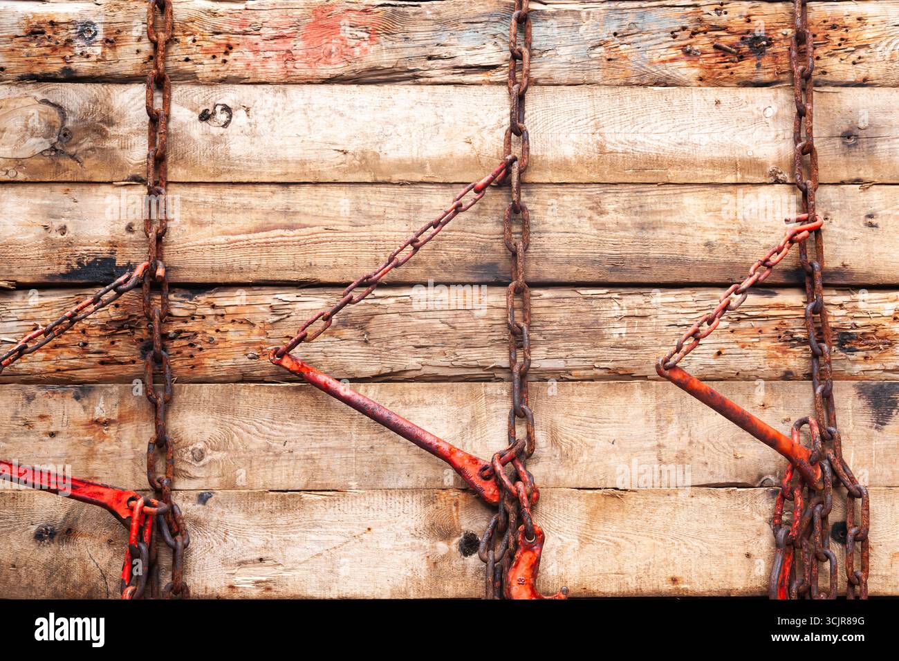 Old wooden blocks are stacked on top of each other and pressed ...