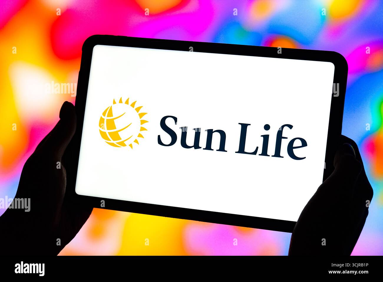 In this photo illustration, the logo of Sun Life is seen displayed on ...