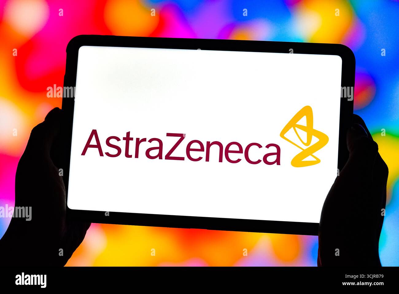 In this photo illustration, the logo of AstraZeneca is seen displayed ...