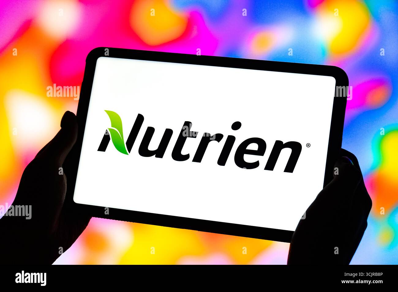 In this photo illustration, the logo of Nutrien is seen displayed on ...