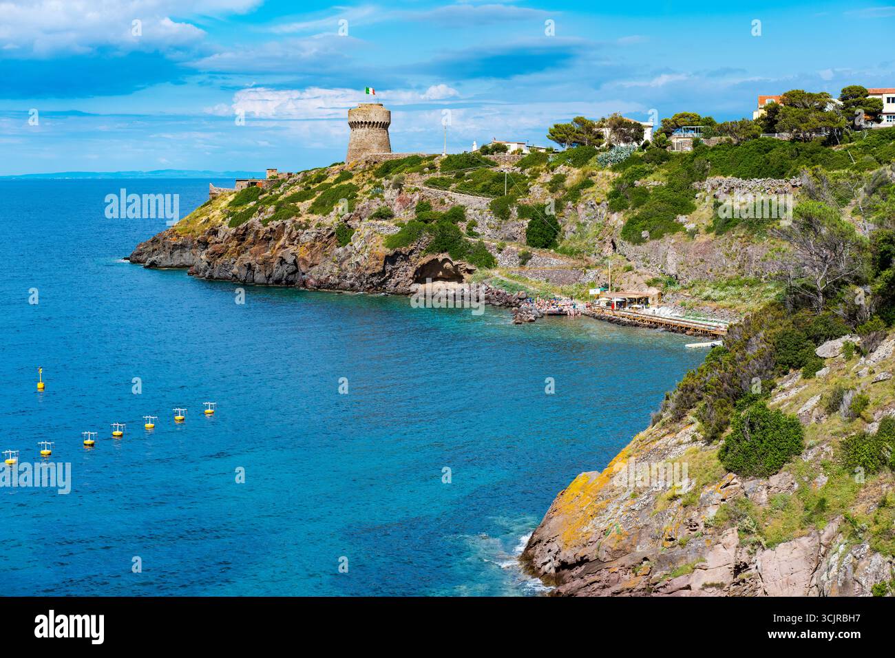 Italian flag waving on the ancient tower of Capraia Island, Tuscany ...