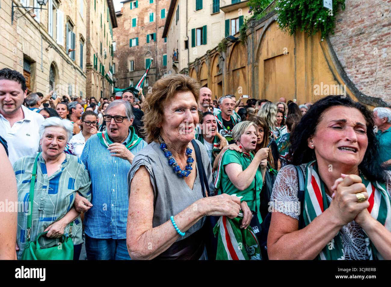 People From The Victorious Oca Contrada En Route To The Church Of Santa ...