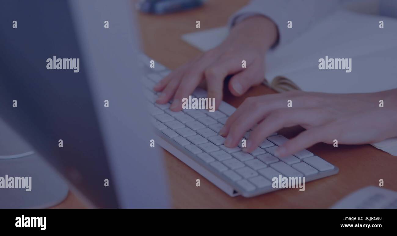 Typing adult female hands entering data at office desk, with white ...
