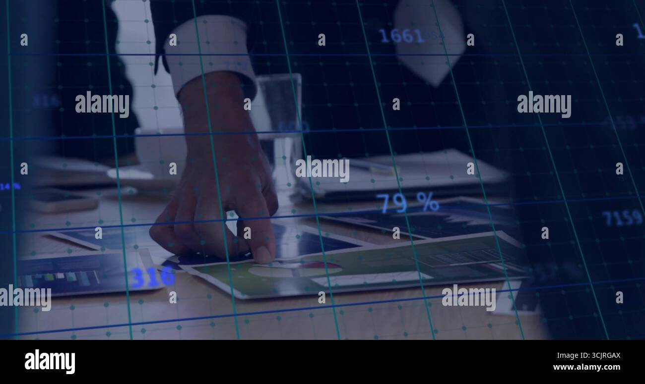Pointing hand highlighting bar graph in meeting room on table, with ...
