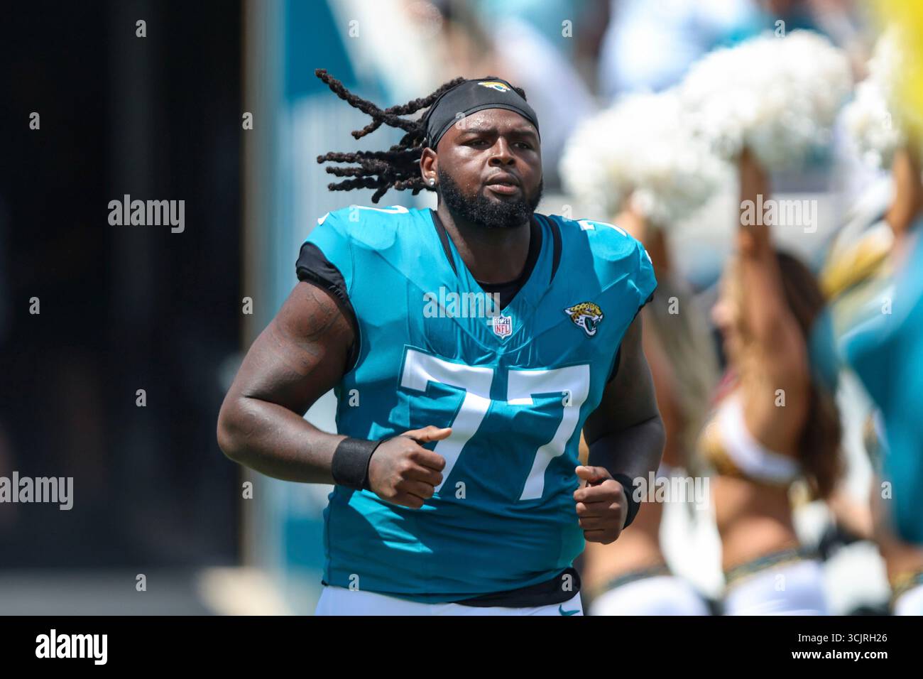 Jacksonville Jaguars offensive tackle Anton Harrison (77) runs onto the ...