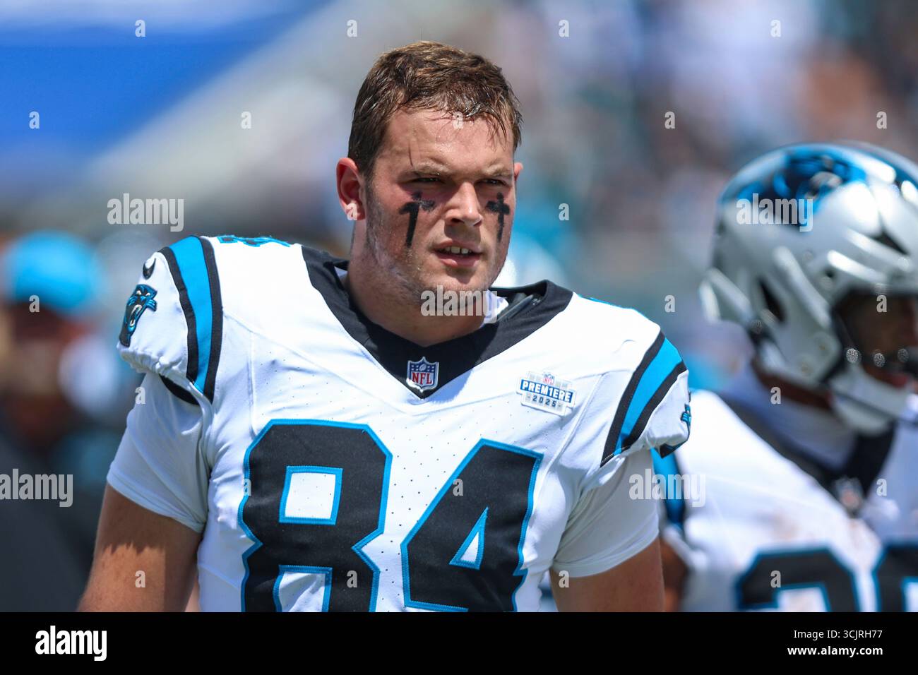 Carolina Panthers tight end Mitchell Evans (84) walks the sideline ...