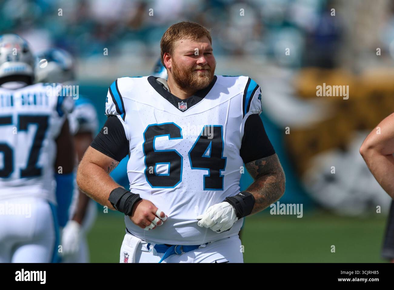Carolina Panthers center Cade Mays (64) walks the sideline during an ...