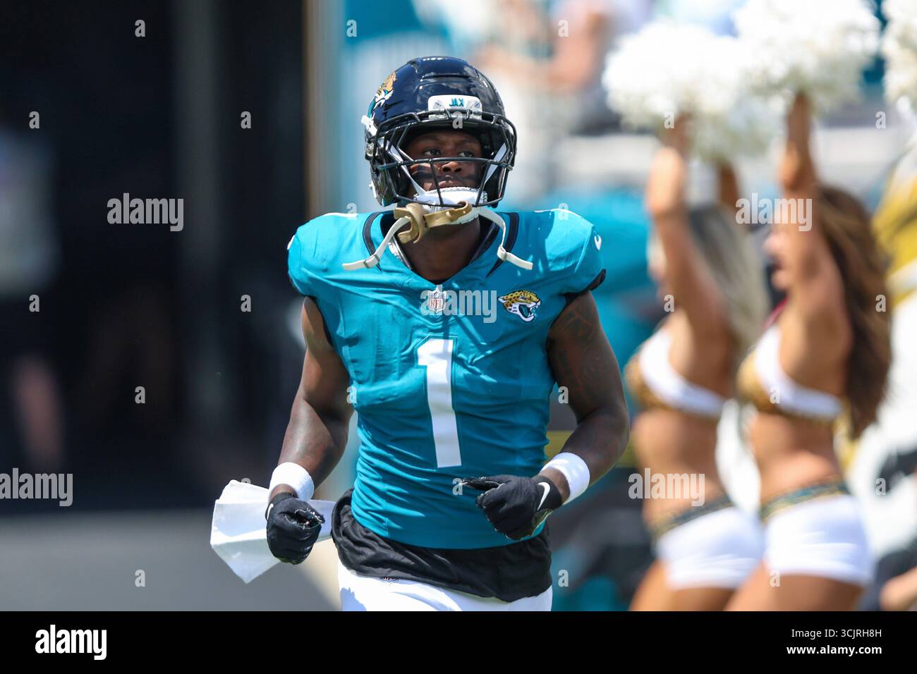 Jacksonville Jaguars running back Travis Etienne Jr. (1) runs onto the ...
