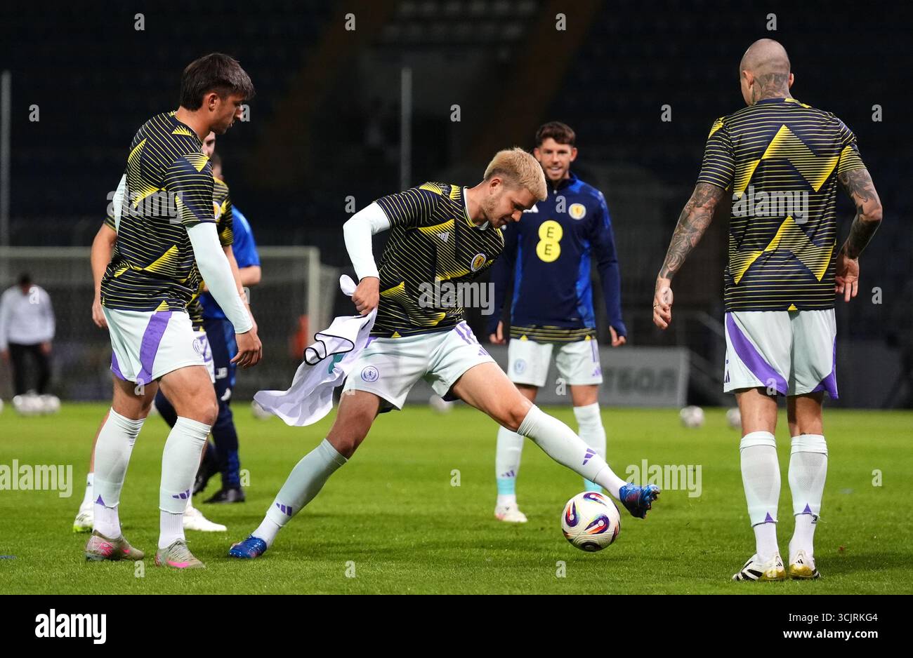 Scotland's George Hirst (centre) warming up ahead of the FIFA World Cup ...