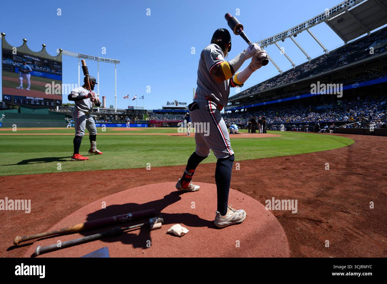 Minnesota Twins' Austin Martin, right, and Twins' Byron Buxton warm up ...