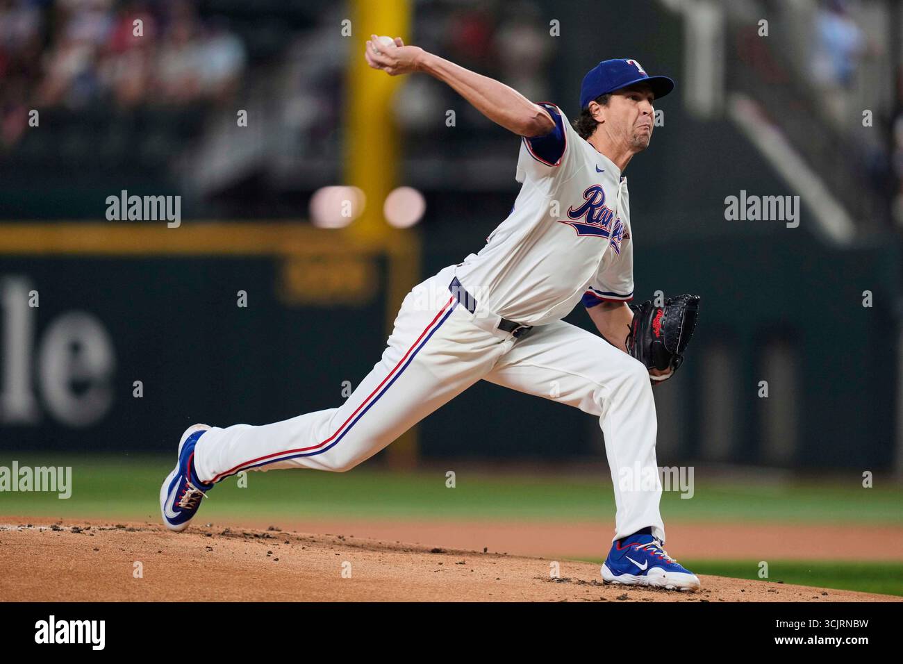 Texas Rangers starting pitcher Jacob deGrom works against the Houston ...