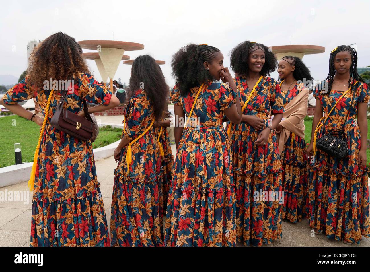 Women wear traditional clothing in the streets in preparation for ...