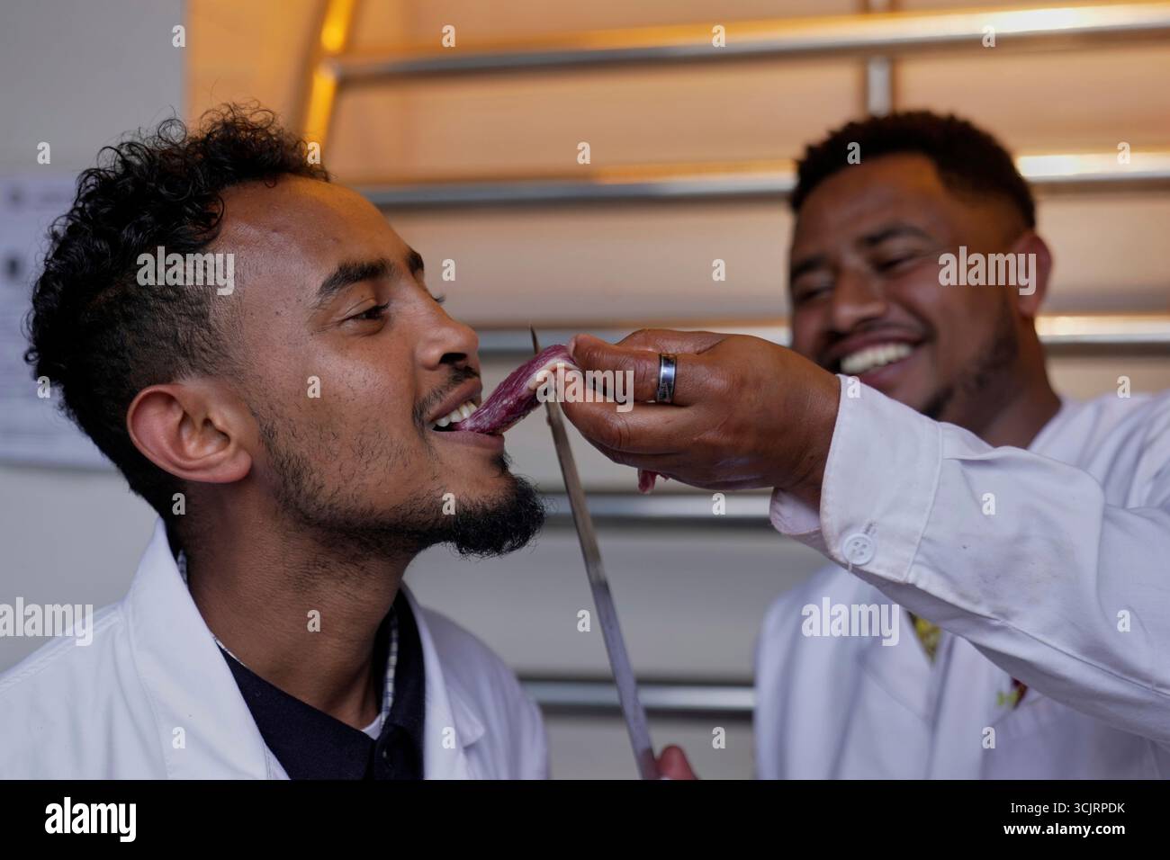 Robel hailu is fed Ethiopian traditional food "kitfo," a dish similar ...