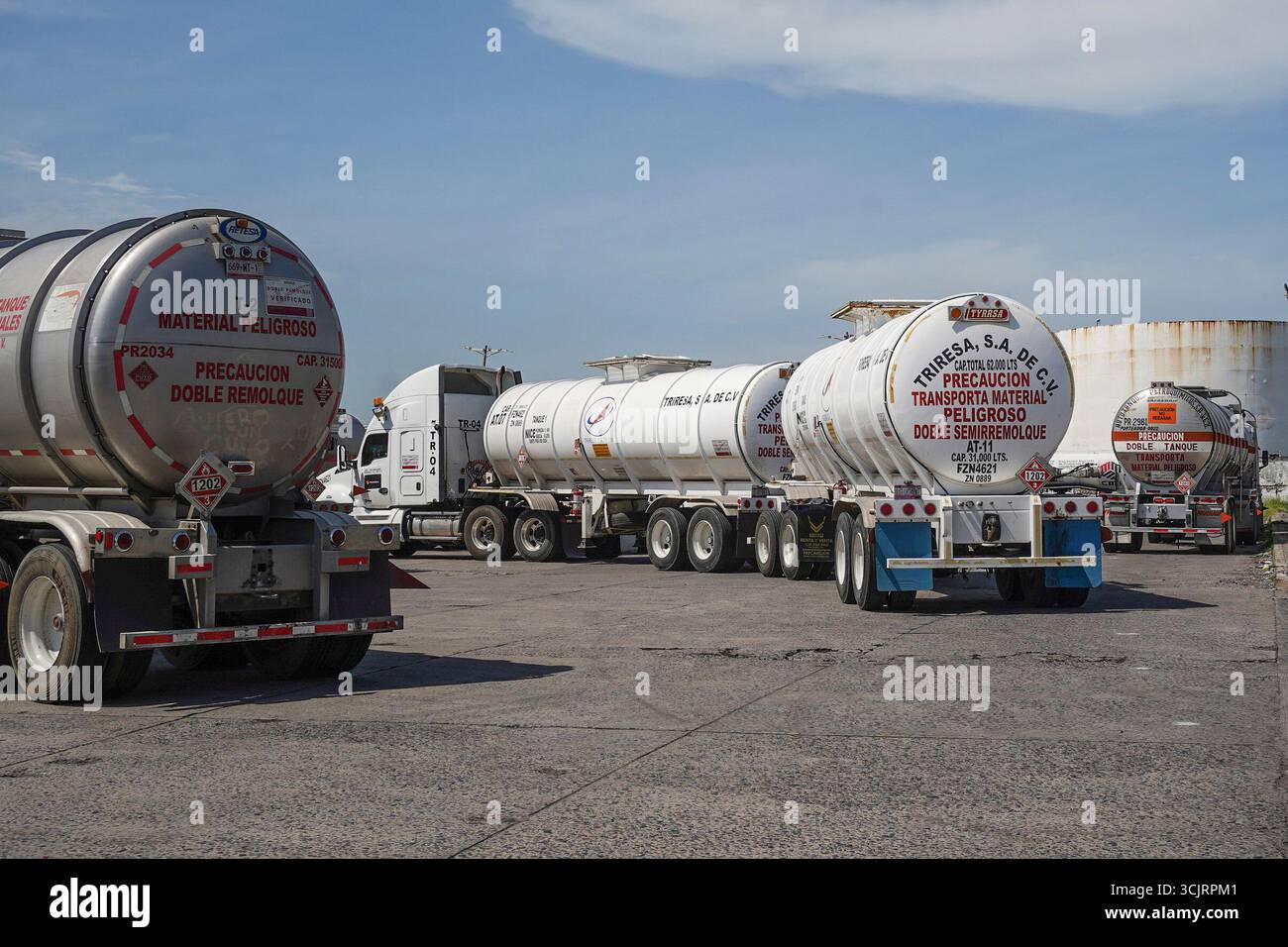 Gasoline trucks wait to enter the Petroleos Mexicanos (PEMEX) fuel ...