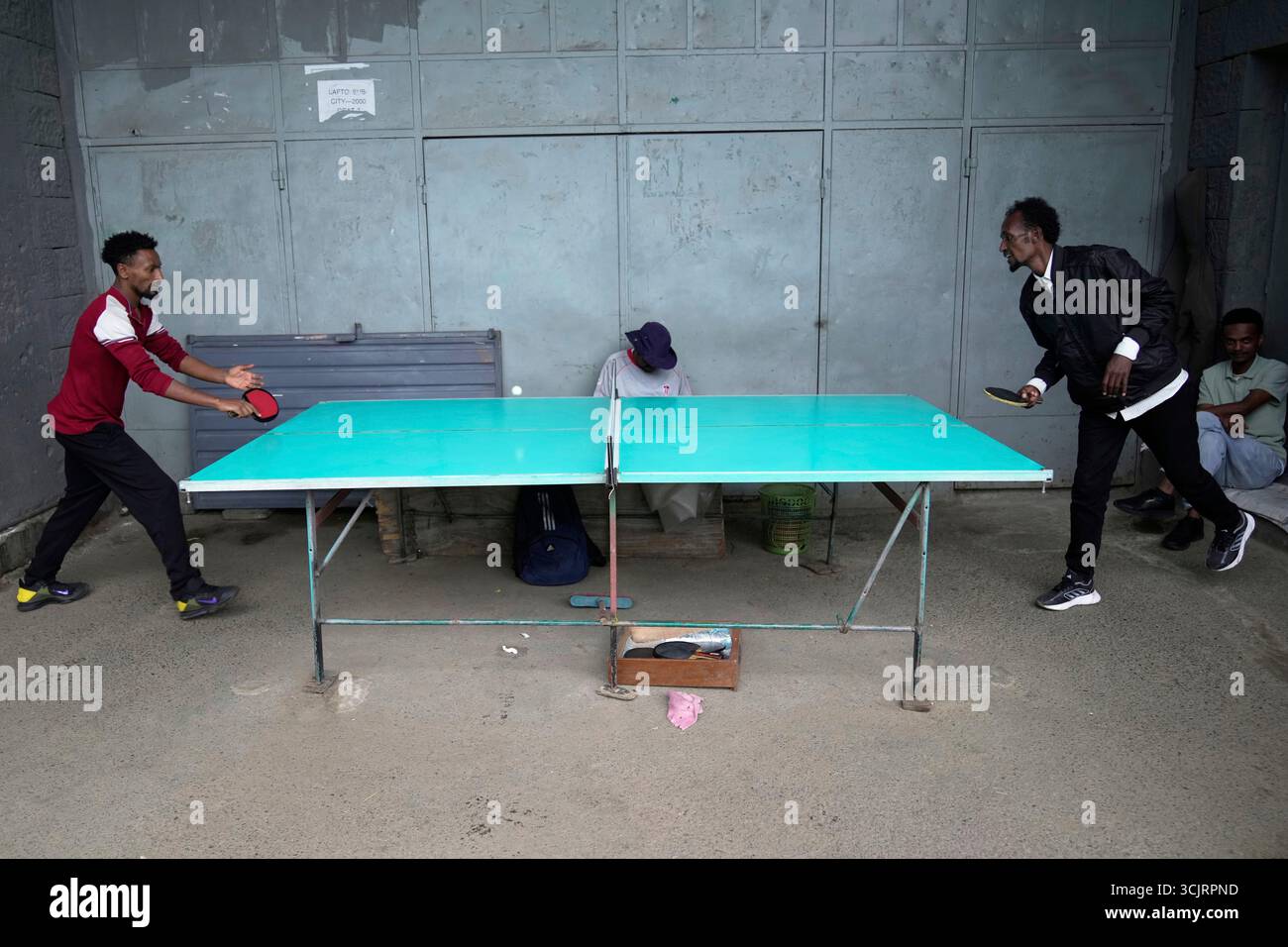 Locals play table tennis in the streets of Addis Ababa, Ethiopia ...