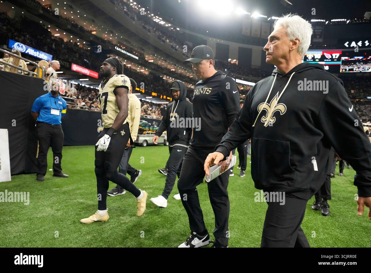 New Orleans Saints head coach Kellen Moore walks off the field for ...