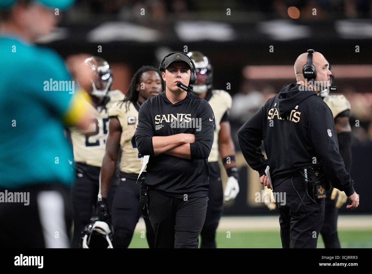 New Orleans Saints head coach Kellen Moore stands near the sideline in ...