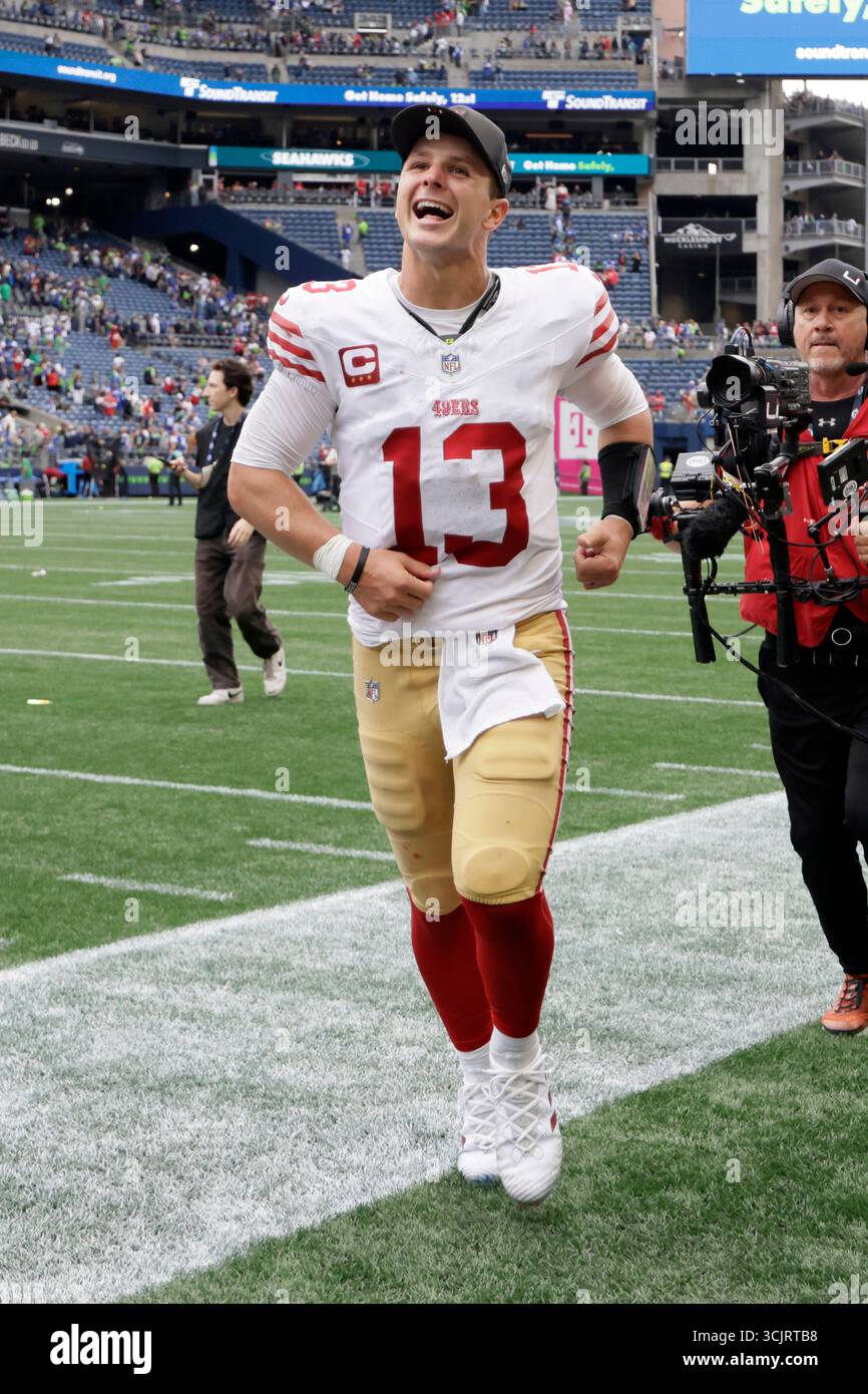 San Francisco 49ers quarterback Brock Purdy (13) runs off the field ...