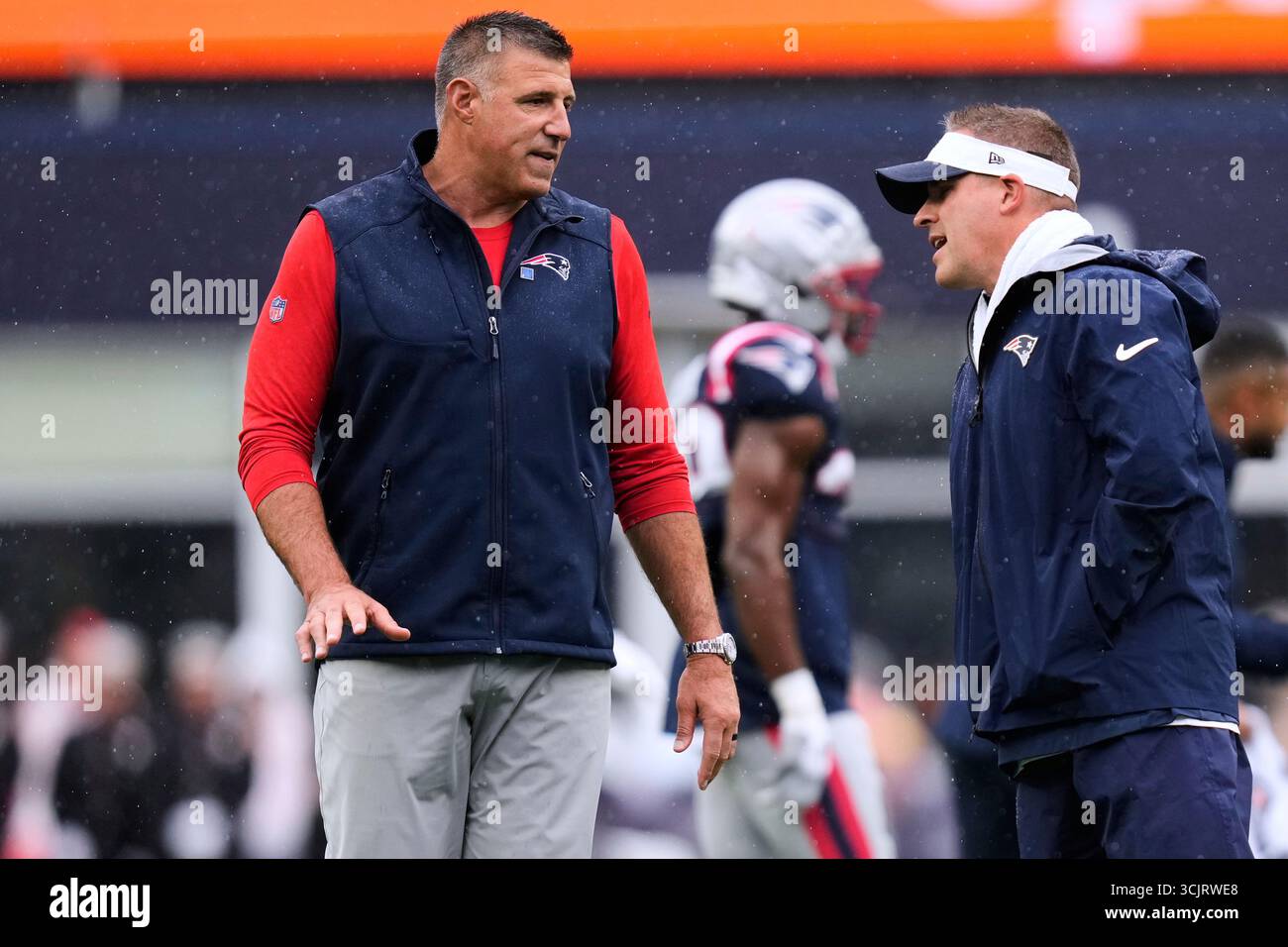 New England Patriots offensive coordinator Josh McDaniels, right, talks ...