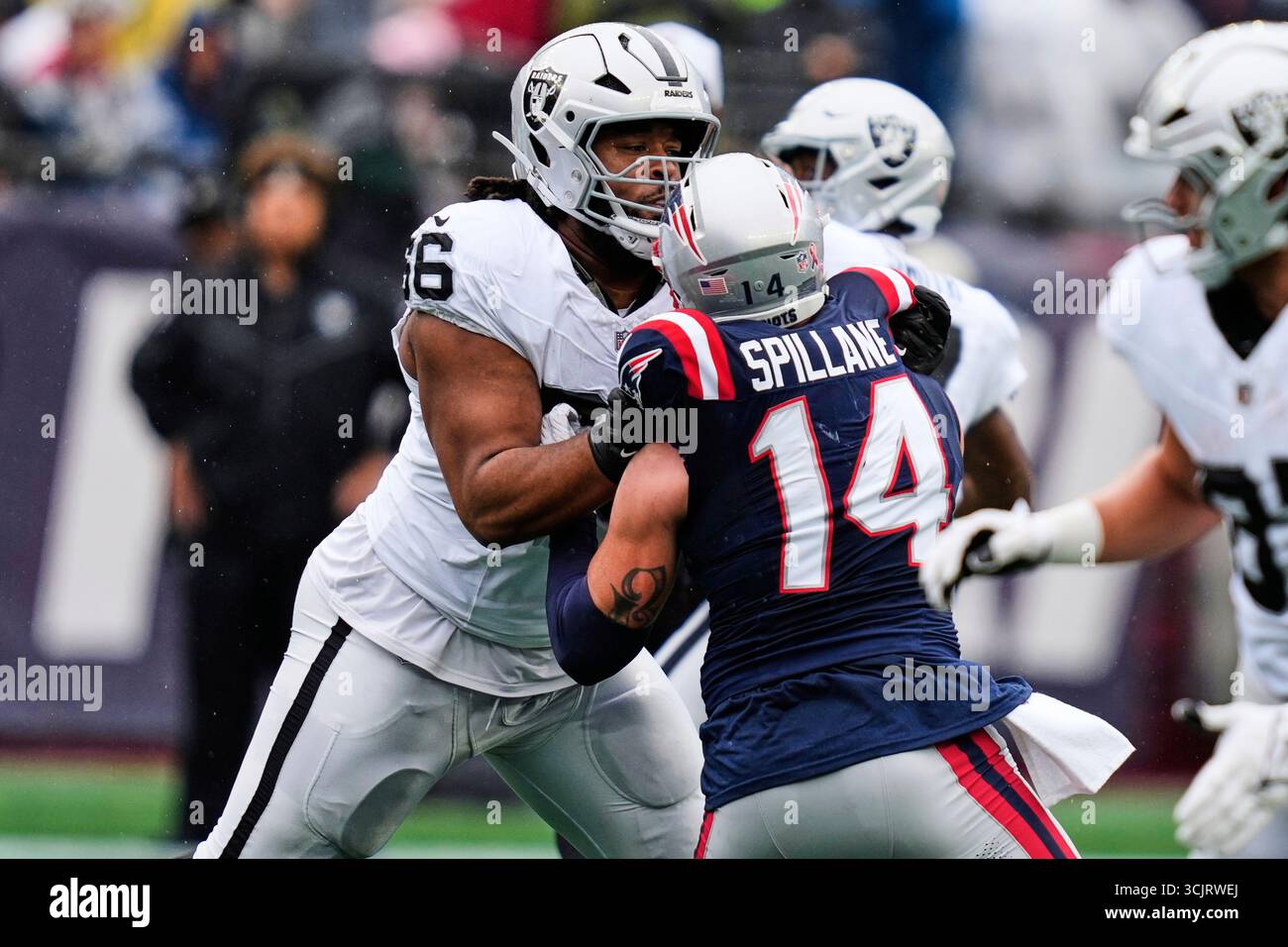 Las Vegas Raiders guard Dylan Parham (66) holds back New England ...