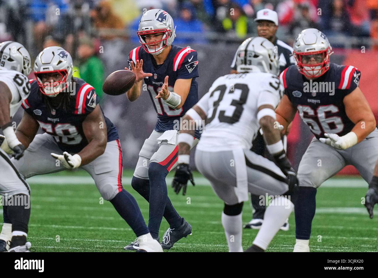 New England Patriots quarterback Drake Maye (10) takes the snap as ...