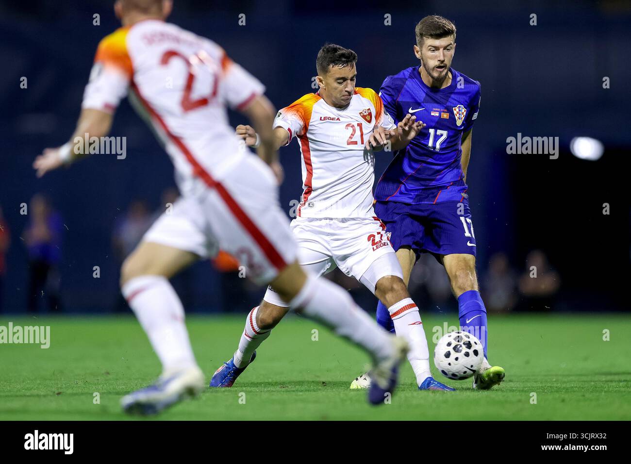 Andrija Bulatovic of Montenegro competes for the ball with Petar Sucic ...