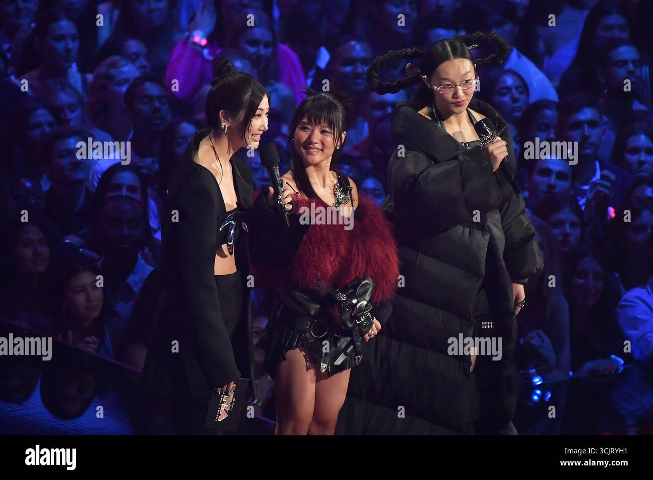 EJAE, Rei Ami, and Audrey Nuna of HUNTR/X onstage during the 2025 MTV Video Music Awards at UBS ...