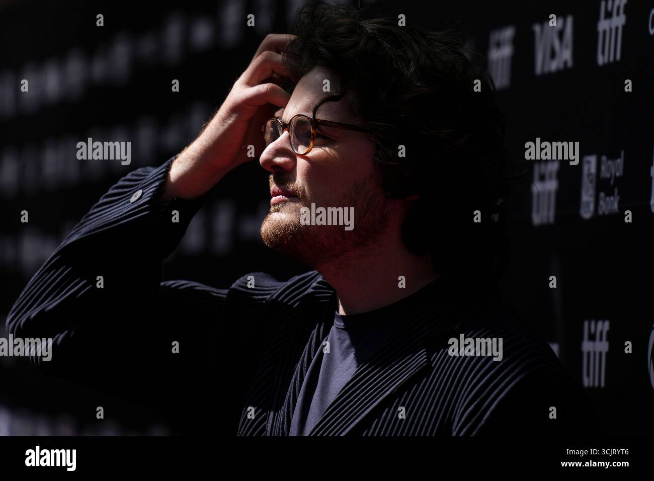 Director Daniel Roher arrives on the red carpet to promote the film ...